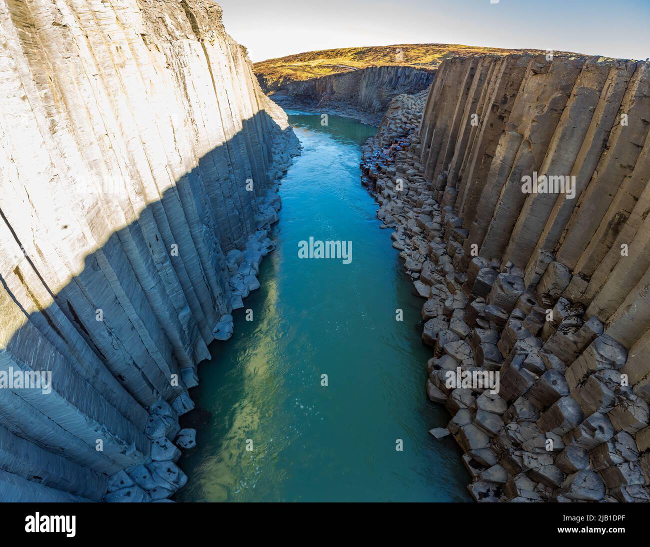Fjadrargljufur basaltic canyon columns and green river Stock Photo - Alamy