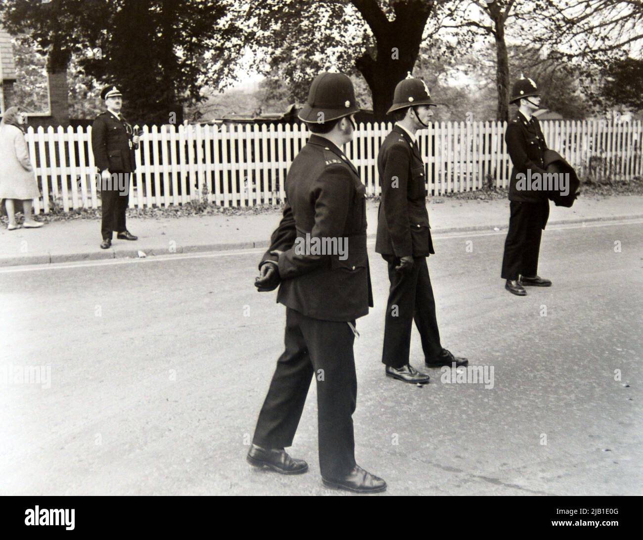 Police officers policing an anti racism demonstration march through ...