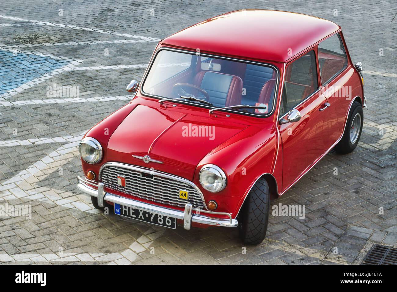 22 May 2022 - Kalkara, Malta: An old bright red Morris Mini Minor ...