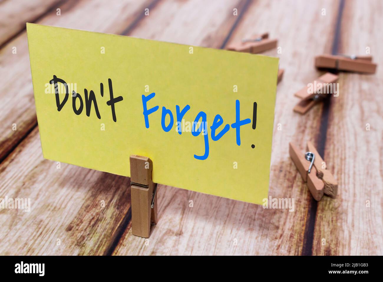 Message card showing Don't Forget on shabby chic table. Natural wooden ...