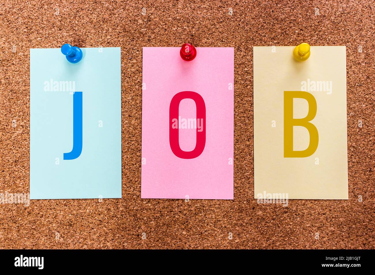 3 letters keyword JOB on multicolored stickers attached to a cork board ...