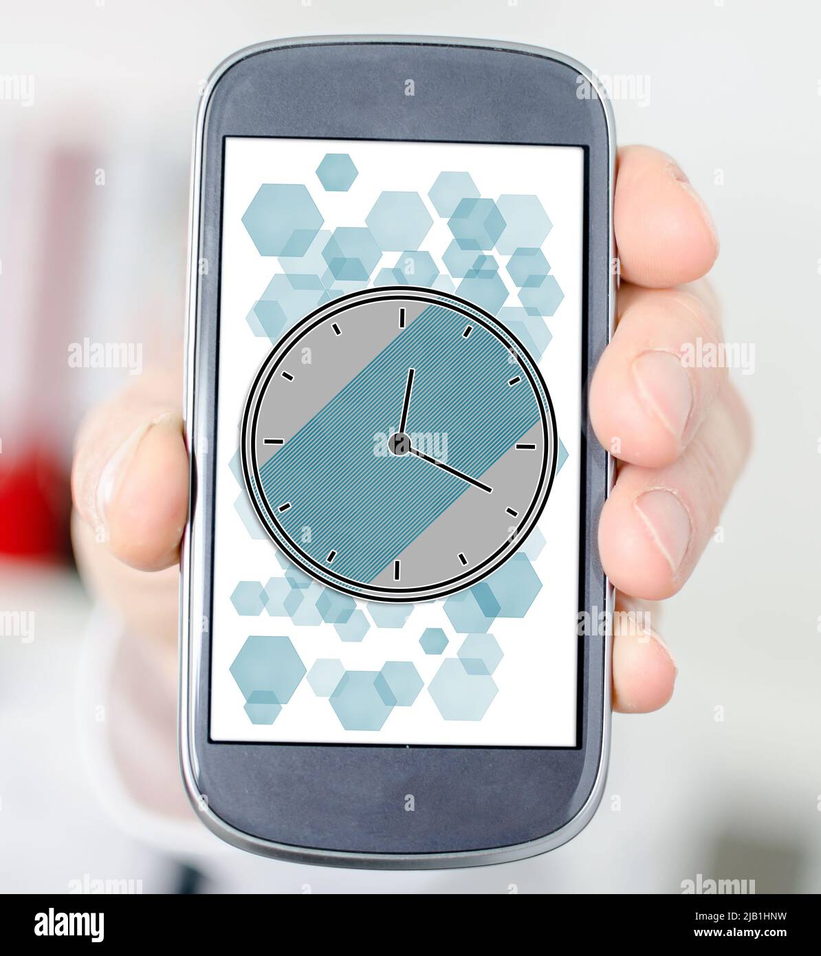 Hand holding a smartphone with time management concept Stock Photo - Alamy