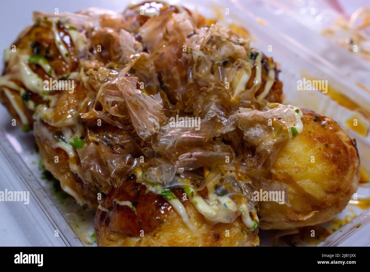 Closeup Takoyaki (octopus balls), ball-shaped Japanese street snack ...