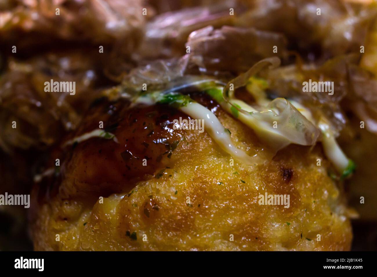Closeup Takoyaki (octopus balls), Japanese street snack made of batter ...