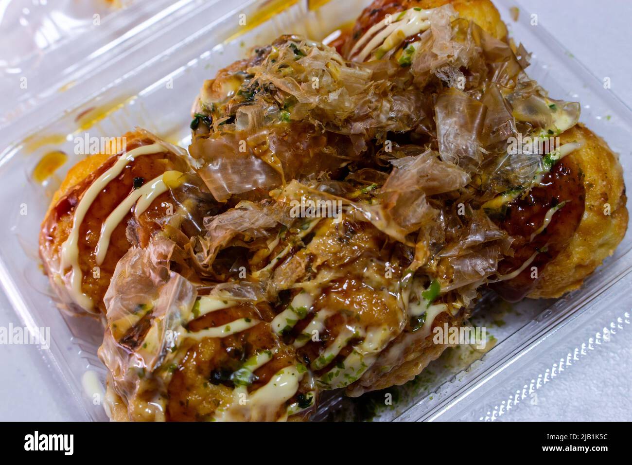 Closeup Takoyaki (octopus balls), ball-shaped Japanese street snack ...