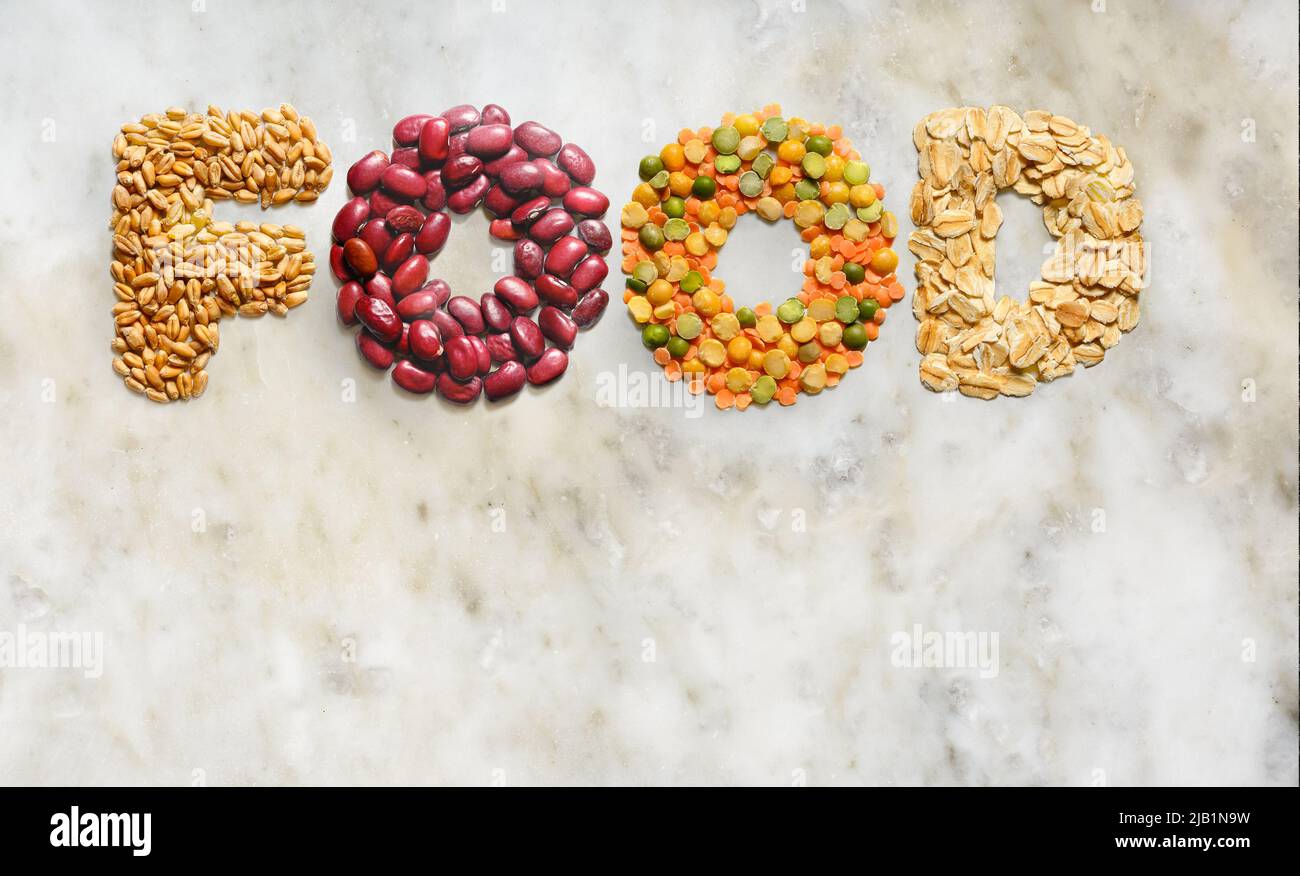 Word FOOD made of cereals on marble slab background Stock Photo - Alamy