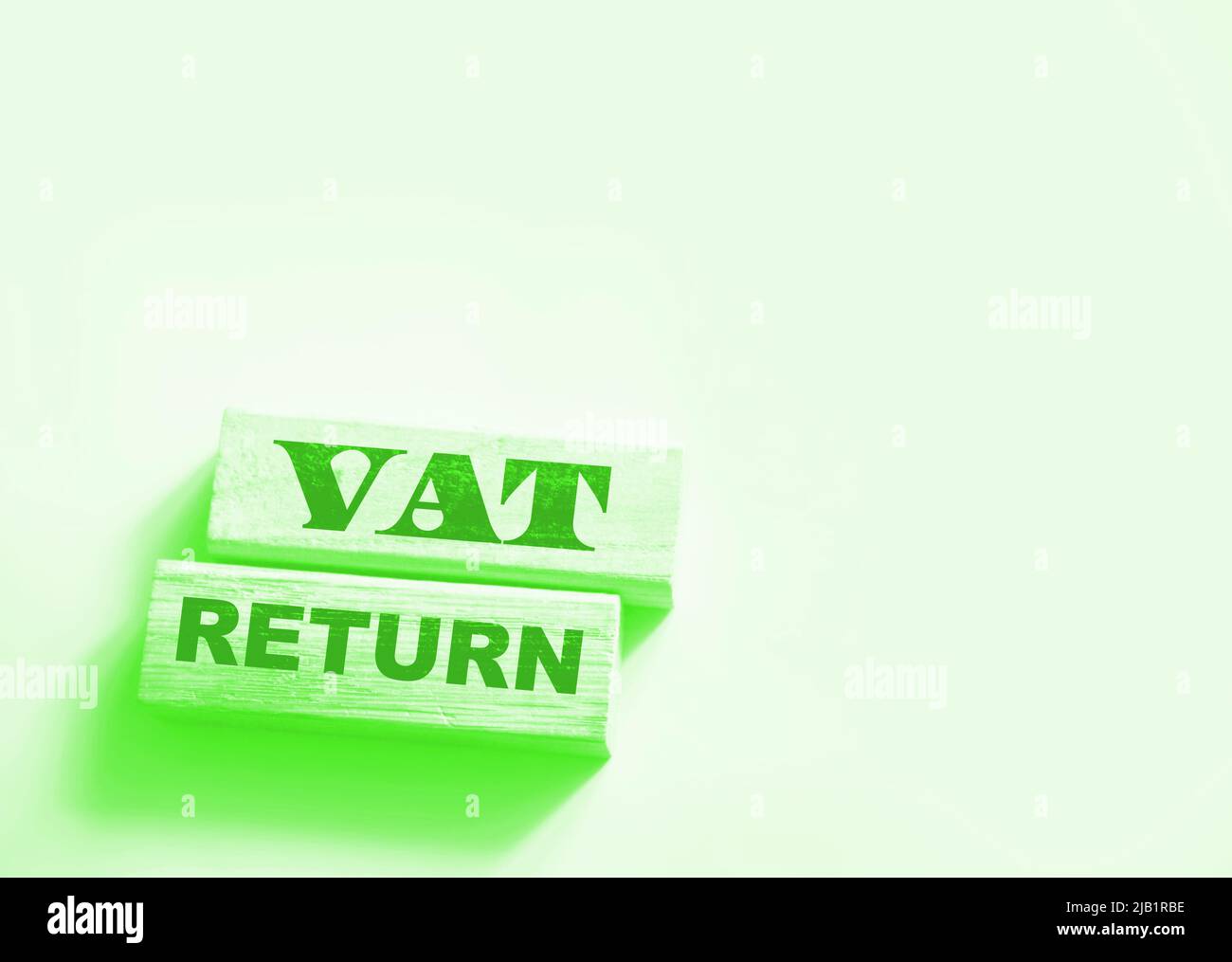 VAT return text Value Added Tax return on wooden blocks on pink ...