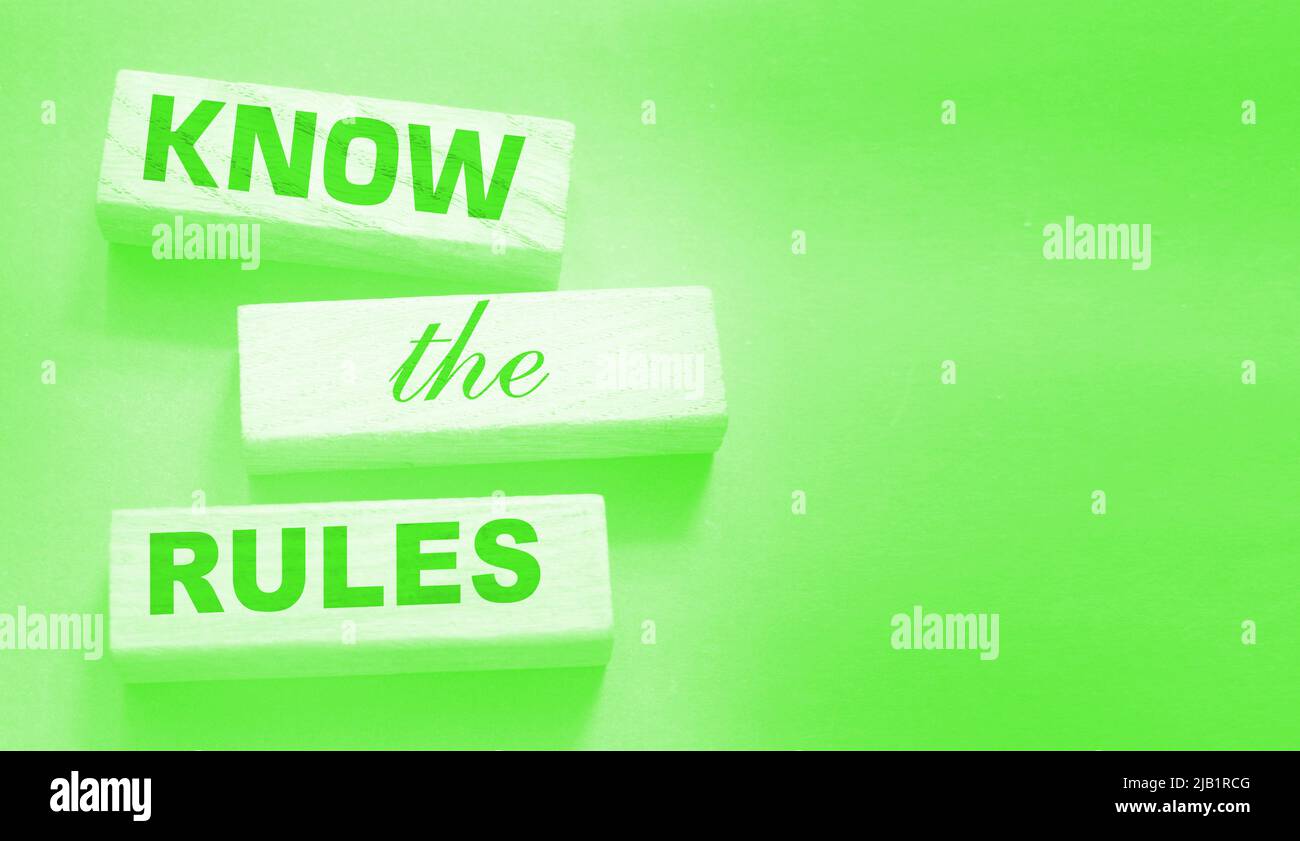 Know the rules word on wooden blocks isolated on dark grey background ...