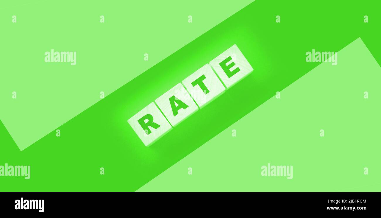 Rate word concept written on wooden cubes blocks lying on a black ...