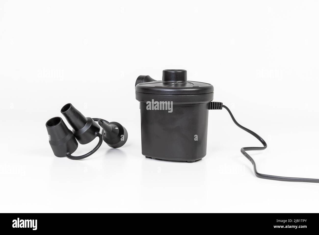 Small electric air pump on white background Stock Photo - Alamy