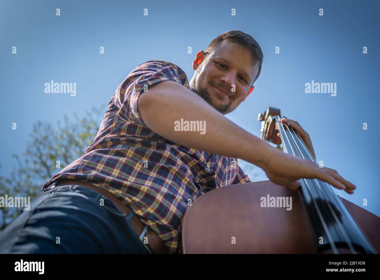 A smiling bass plyer Stock Photo - Alamy