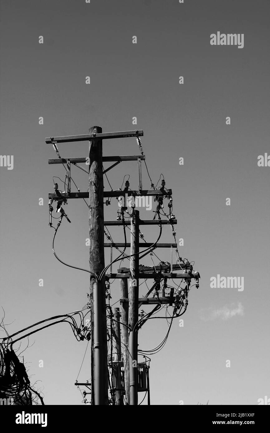 Tall power tower with lots of wires and cables in black and white Stock ...