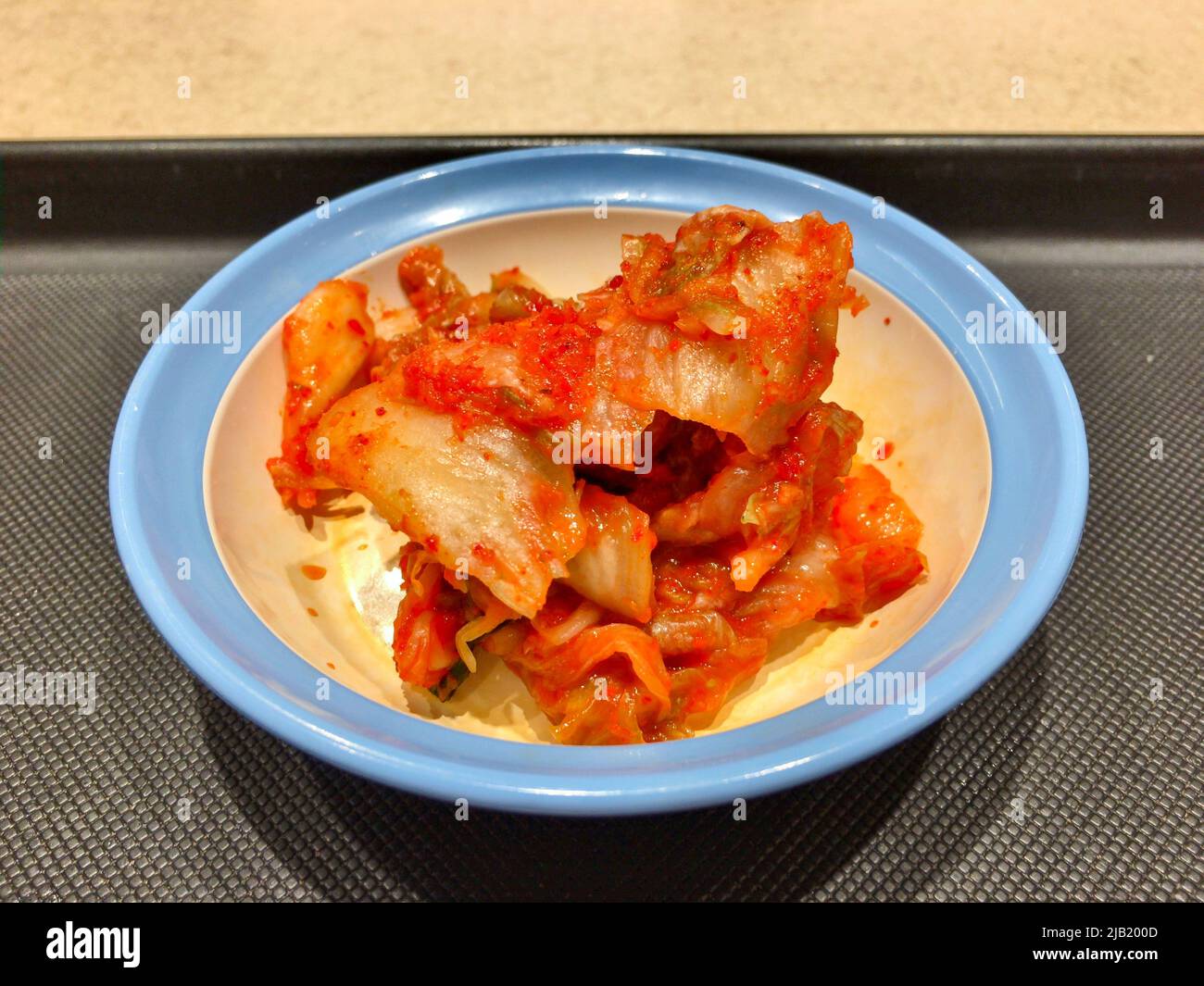 Korean staple food Kimchi (Kimchee) in a small bowl. Kimchi is a side ...