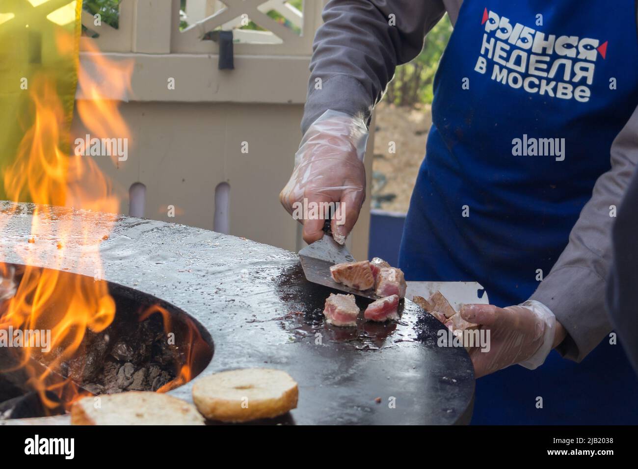 The process of cooking seafood: tuna fish on a brazier. Open fire ...