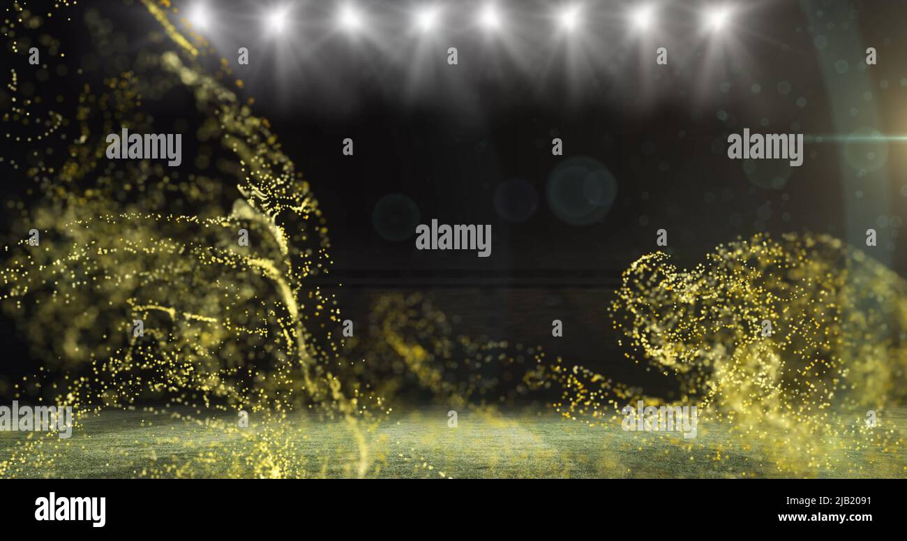 Image of golden particles moving over floodlit room Stock Photo - Alamy