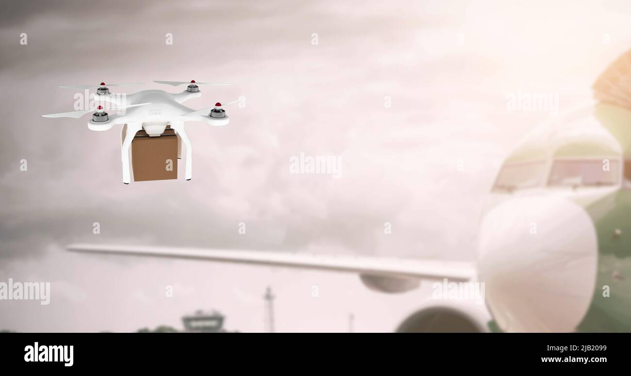 Drone carrying a box beside an airplane Stock Photo - Alamy