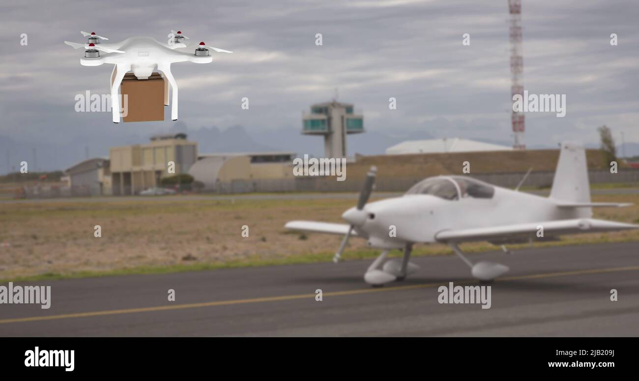 Drone carrying a box and an airplane Stock Photo - Alamy