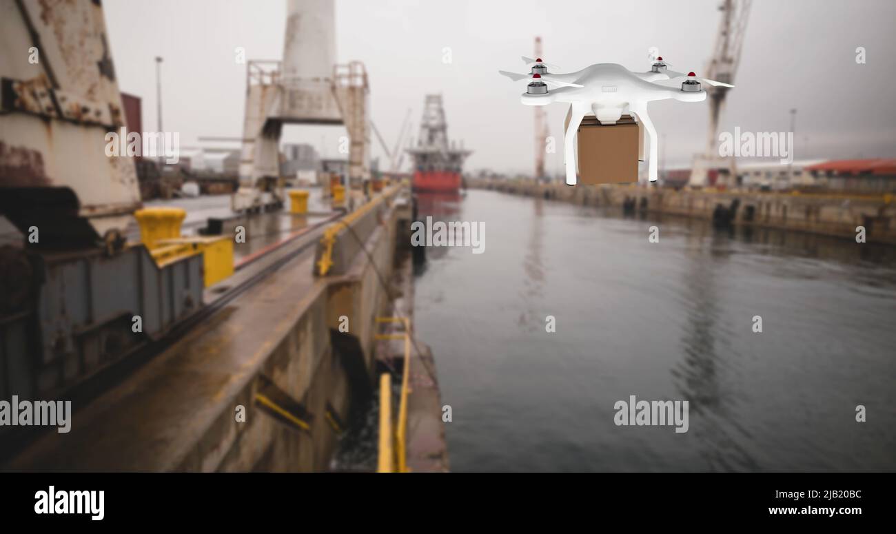 Drone carrying a box in a port Stock Photo - Alamy