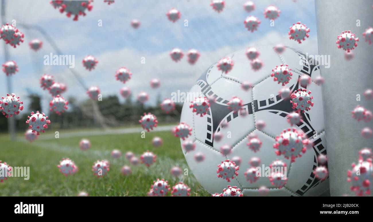 Covid-19 cells against soccer ball on sports field Stock Photo - Alamy