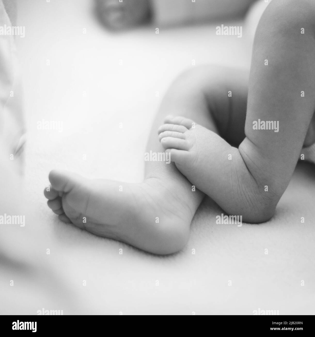 Cute baby legs Black and White Stock Photos & Images - Alamy