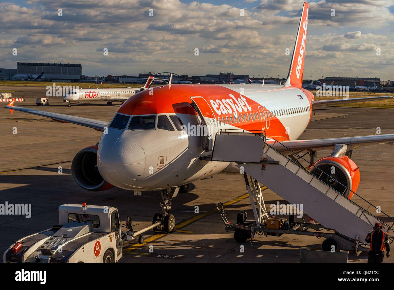 Head on view of an Easy Jet Airbus A320 with tarmac boarding stairs ...