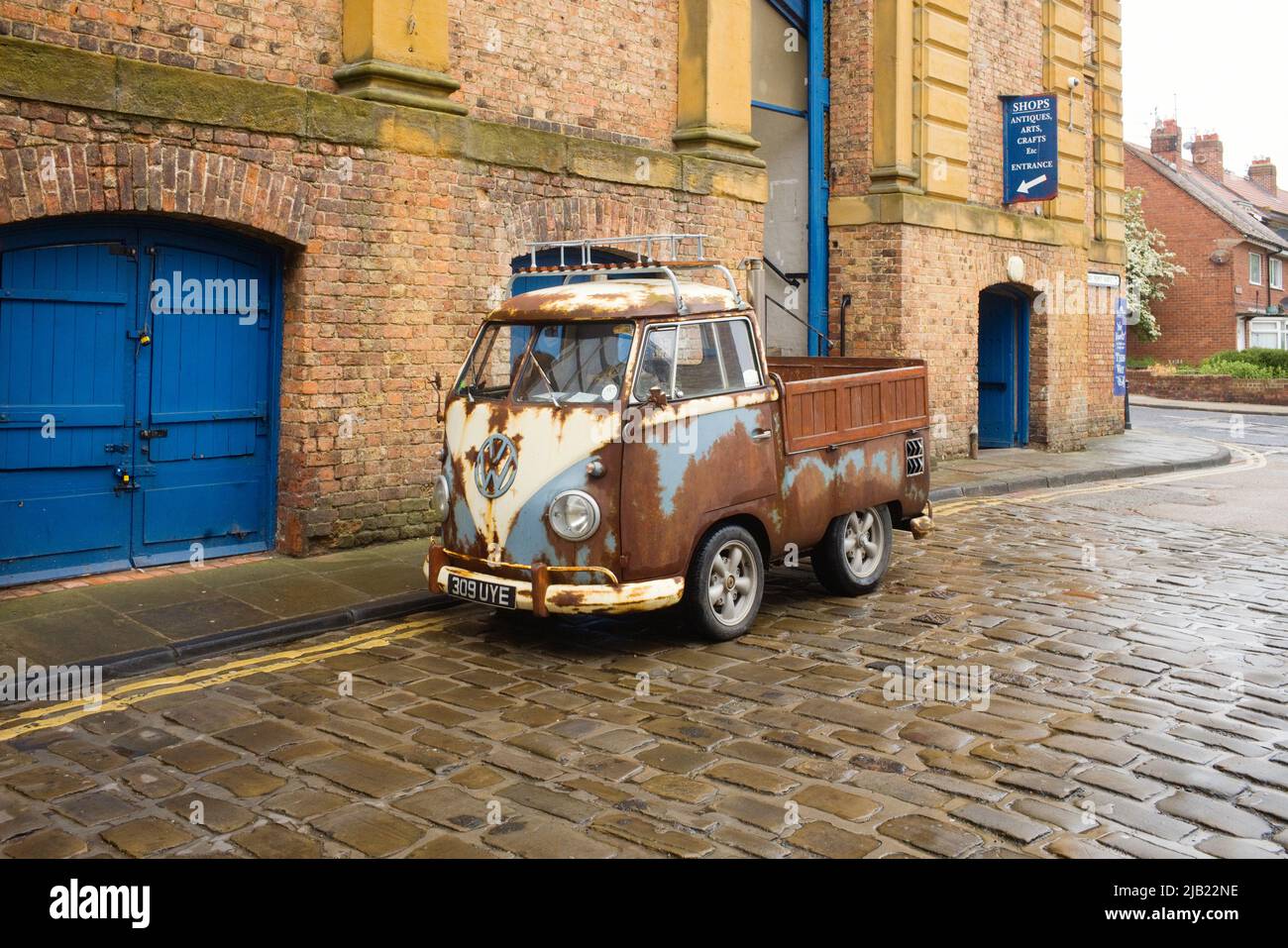 A custom shortened VW pick up van outside the market hall in ...