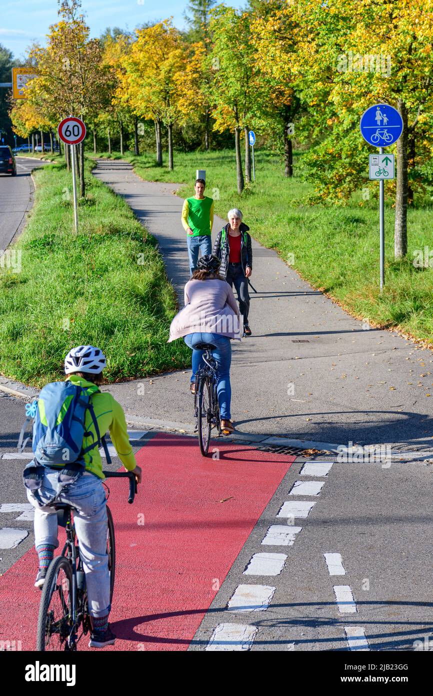 Cyclists changing from the cycle path to a combined cycling road and ...