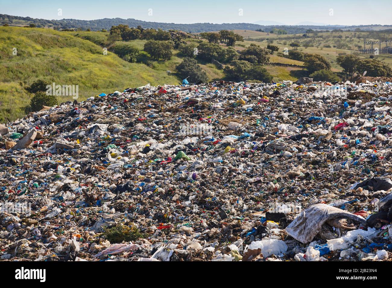 Open air garbage dump. Plastic pollution. Recycling junk. Consumerism ...