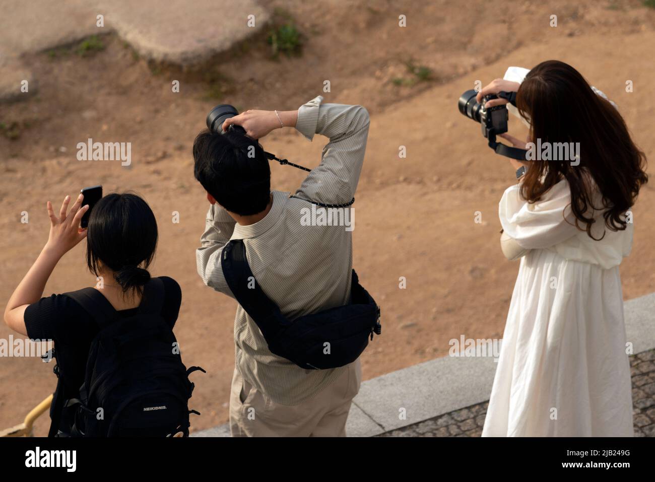 A rear view of Japanese tourists with cameras Stock Photo - Alamy