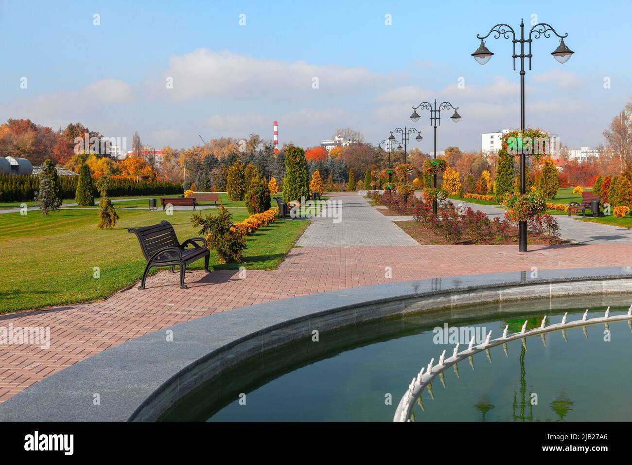 Walkside in the public park . City park with alley and fountain Stock ...