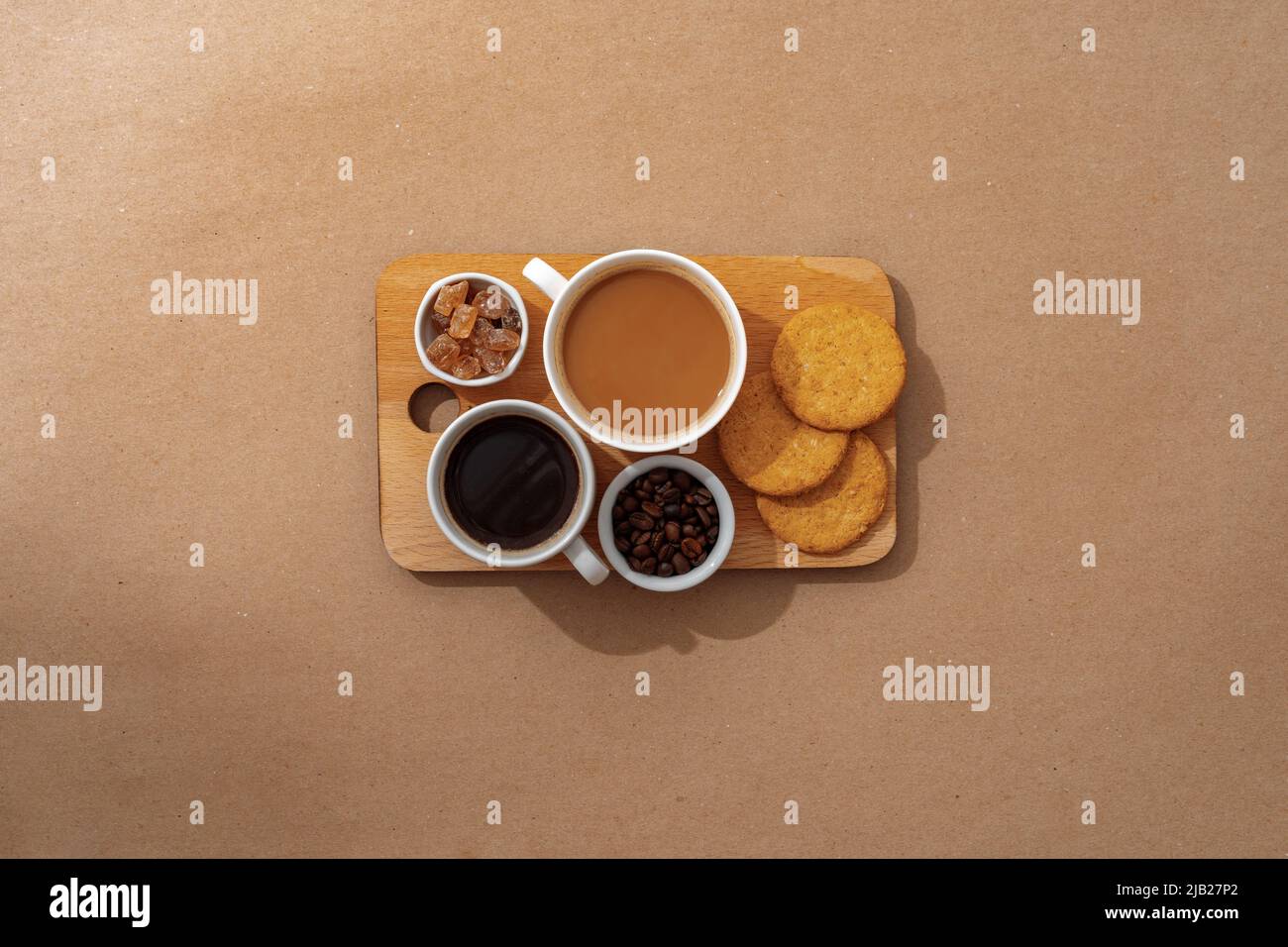 Top view of the wooden tray with coffee cup on beige background Stock ...