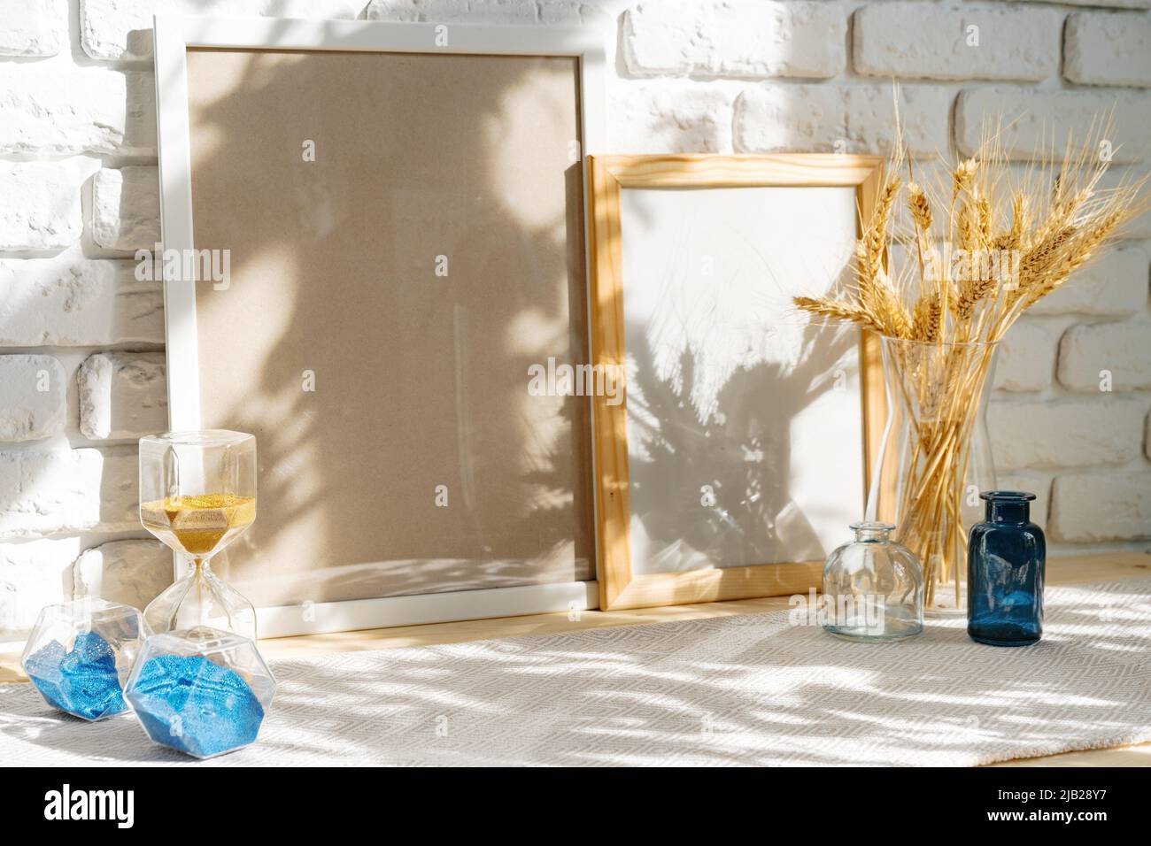 Photo frames on a brick wall background on the table with wheat ears in ...