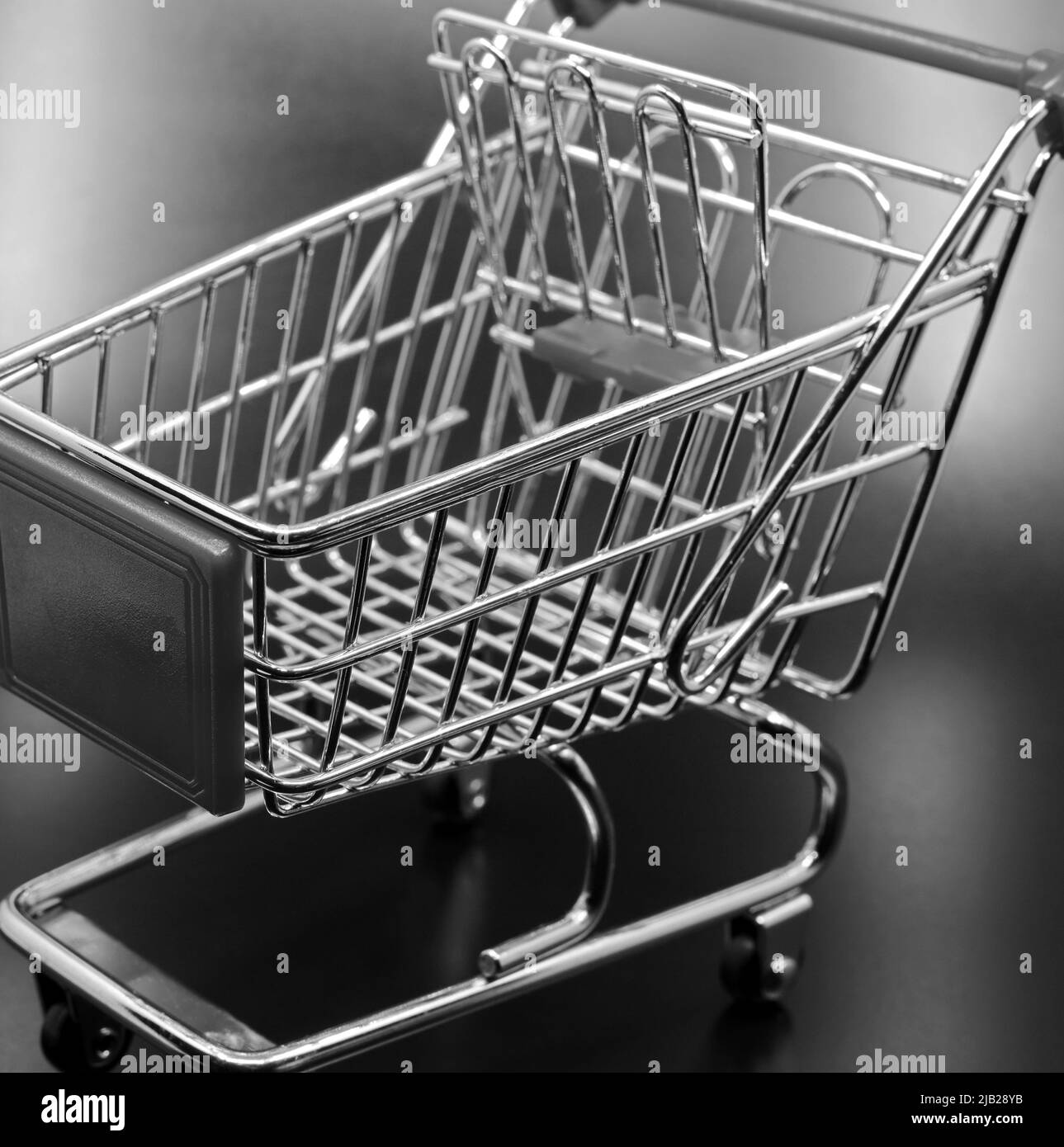 black and white empty shopping cart on a background Stock Photo - Alamy