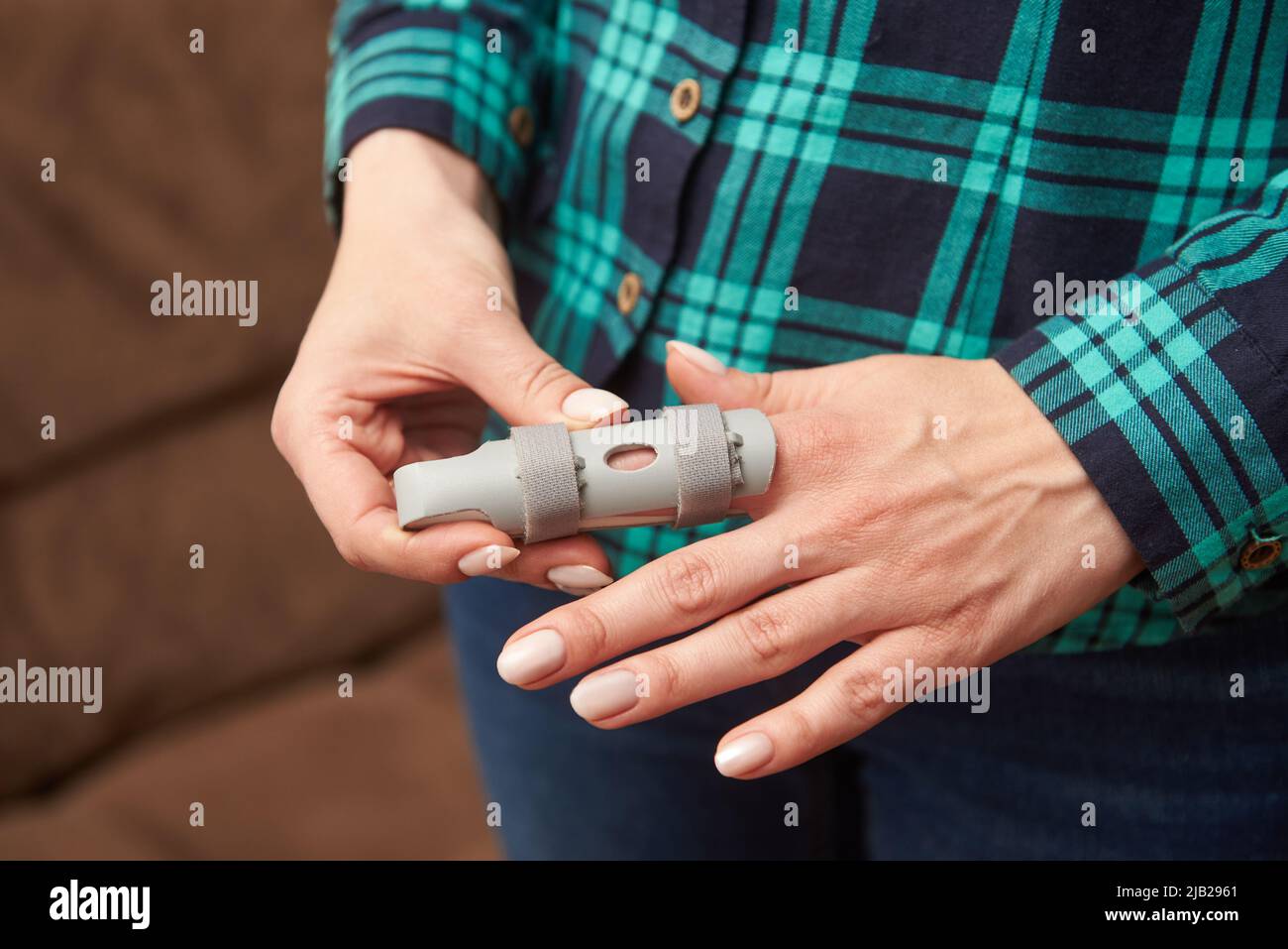 Orthosis on the finger of a female hand Stock Photo - Alamy