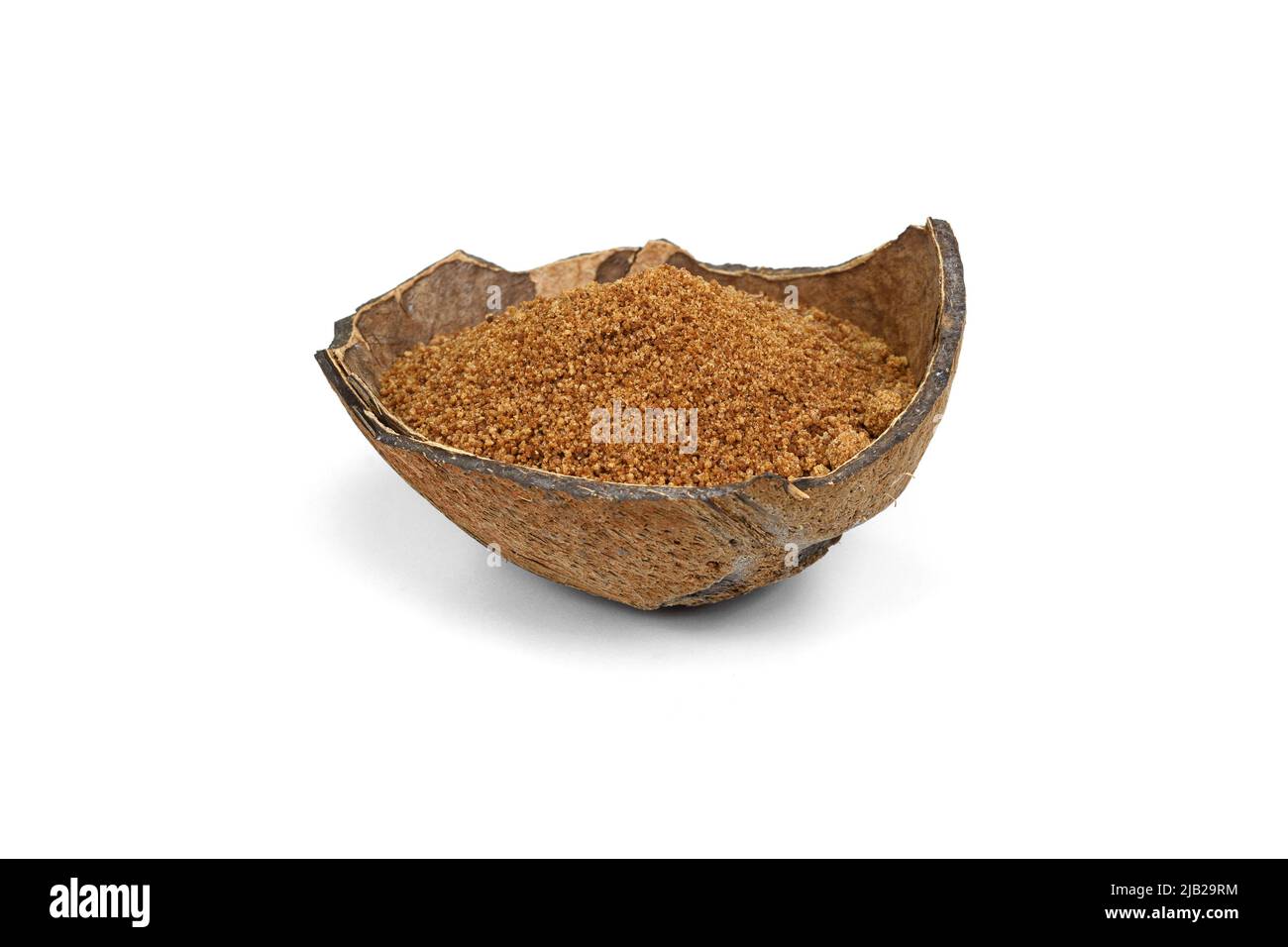 Sweet coconut sugar in coconut shell isolated on white background Stock ...