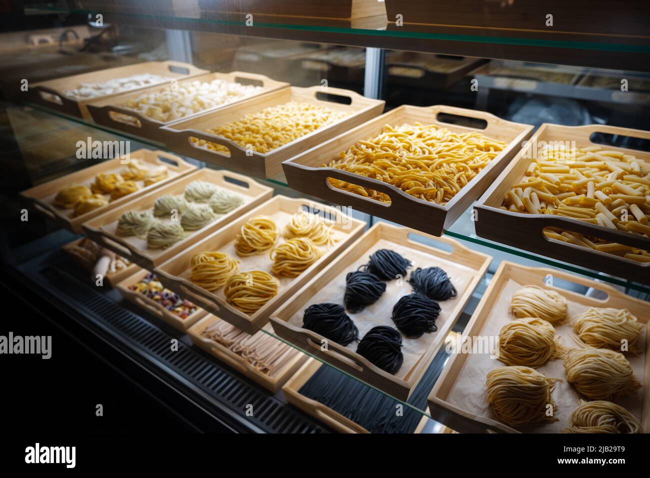 Italian fresh made colorful pasta in shop window Stock Photo - Alamy