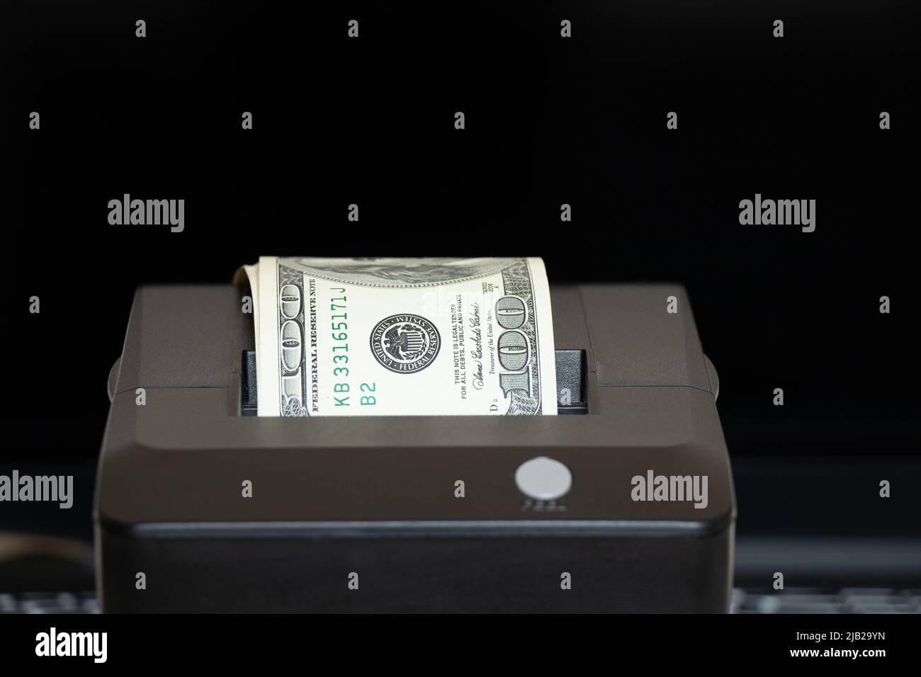 Dollar bill on laptop hi-res stock photography and images - Alamy