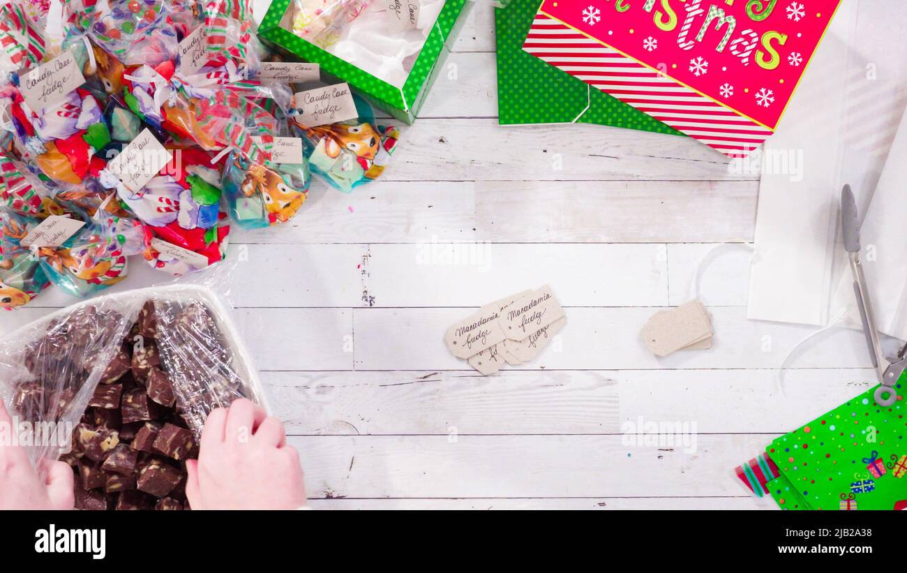 Flat lay. Step by step. Packaging homemade macadamia fudge into small ...