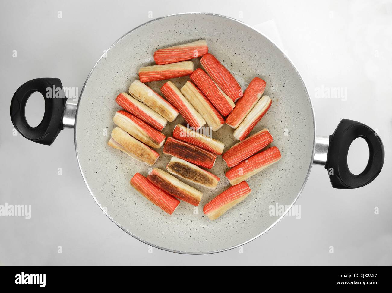 Fried Crab sticks in frying pan Stock Photo - Alamy