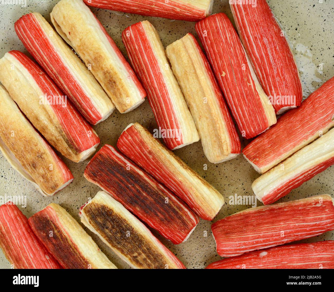 Fried Crab sticks in frying pan Stock Photo - Alamy