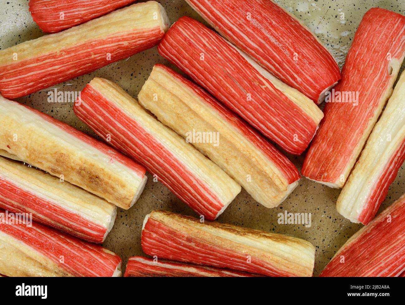 Fried Crab sticks in frying pan Stock Photo - Alamy