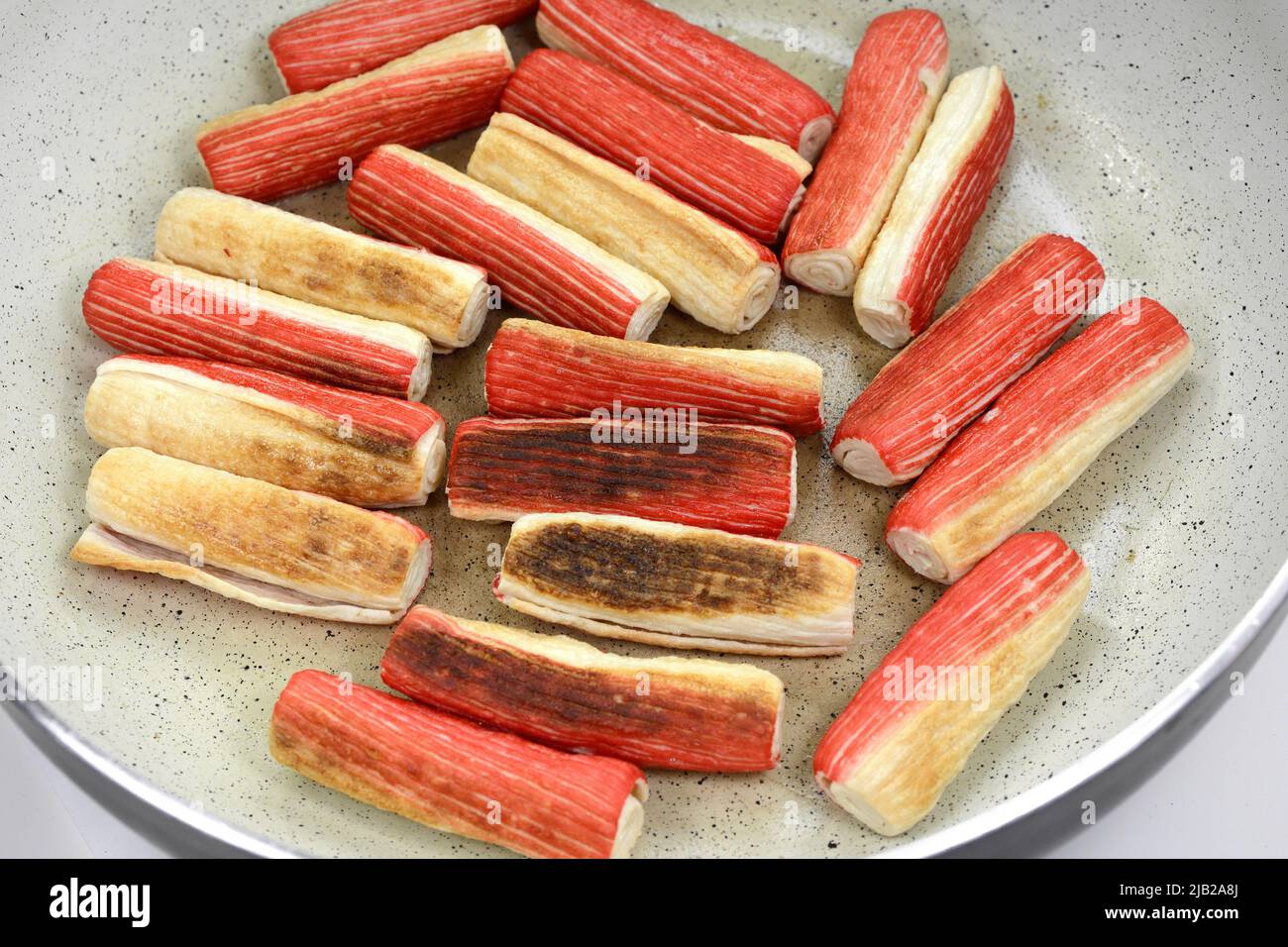 Fried Crab sticks in frying pan Stock Photo - Alamy