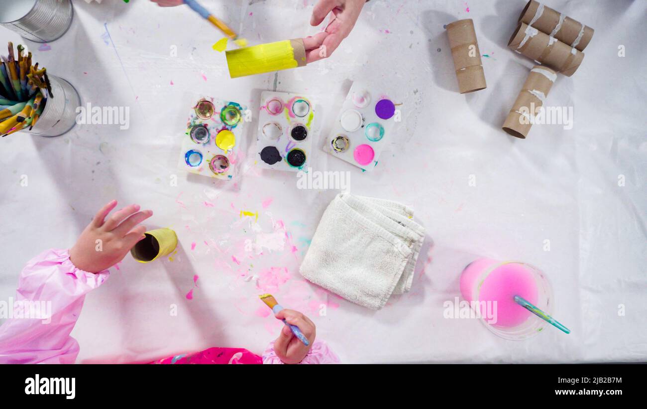 Flat Lay Kids Papercraft Painting Empty Toilet Paper Rolls With Acrylic Paint To Create Paper flat-lay-kids-papercraft-painting-empty-toilet-paper-rolls-with-acrylic-paint-to-create-paper