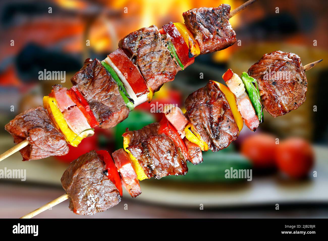 Meat skewer with bacon and vegetables Stock Photo - Alamy
