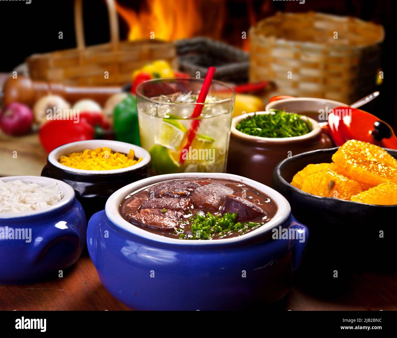 Traditional Brazilian food called feijoada. Black beans with pork, with ...