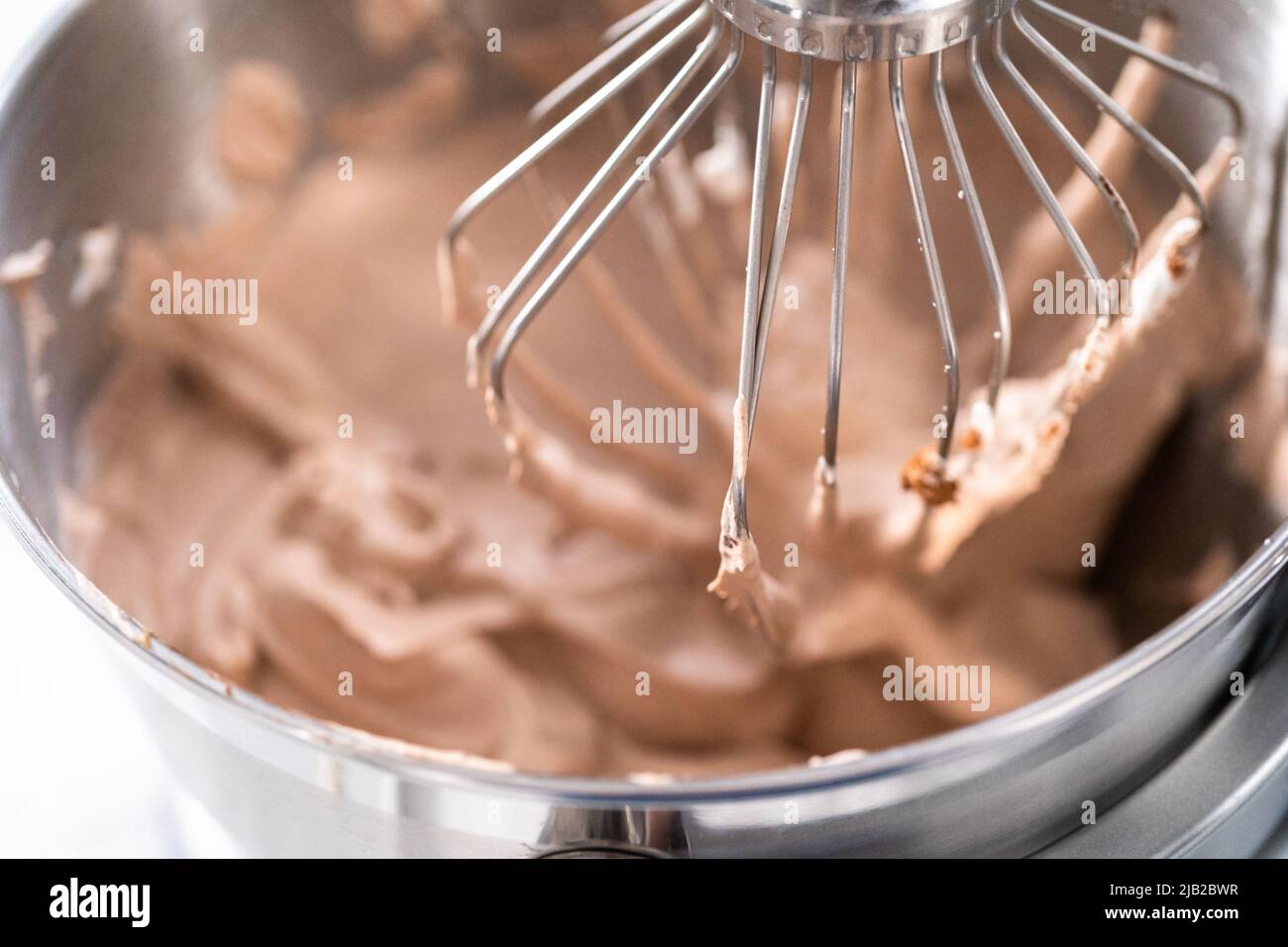Mixing ingredients in a standing kitchen mixer to make homemade ...