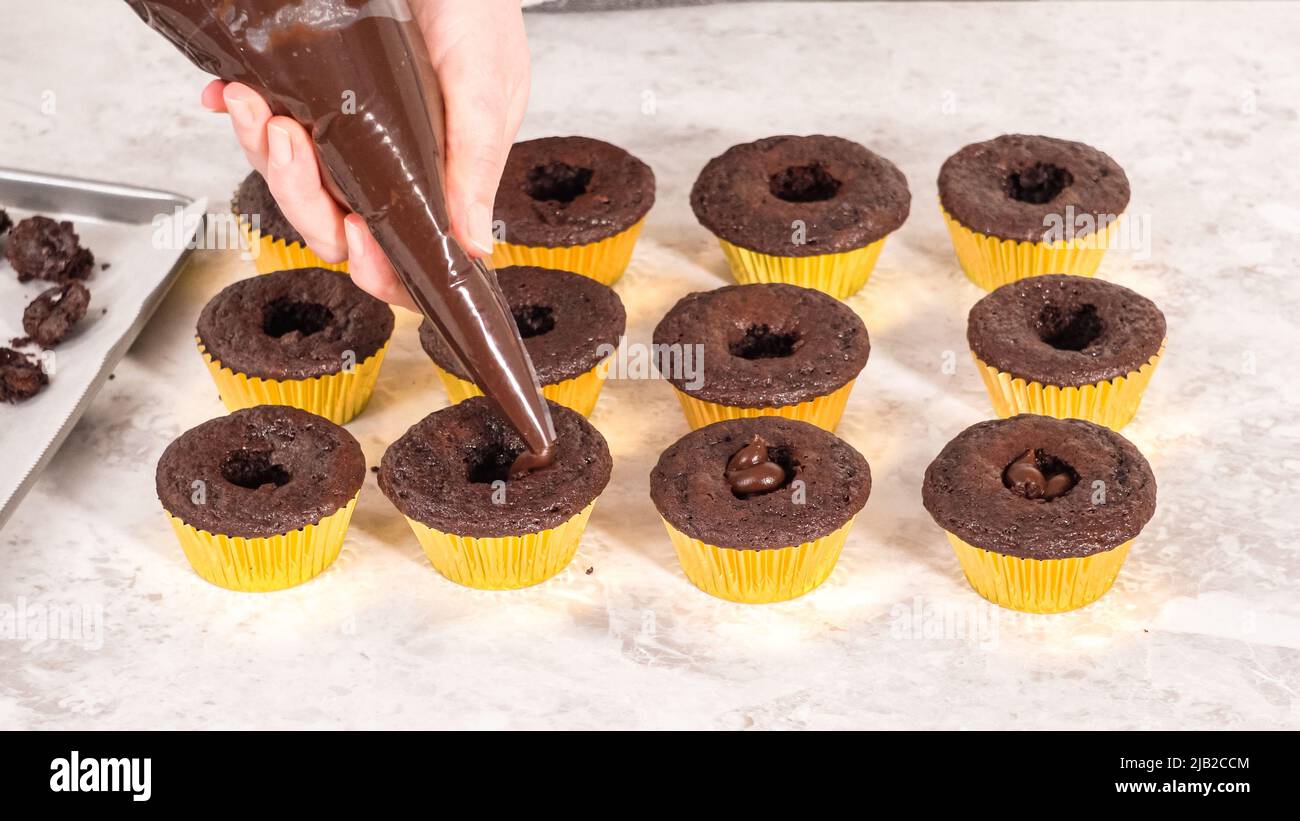 Step by step. Filling in chocolate cupcakes with chocolate ganache ...