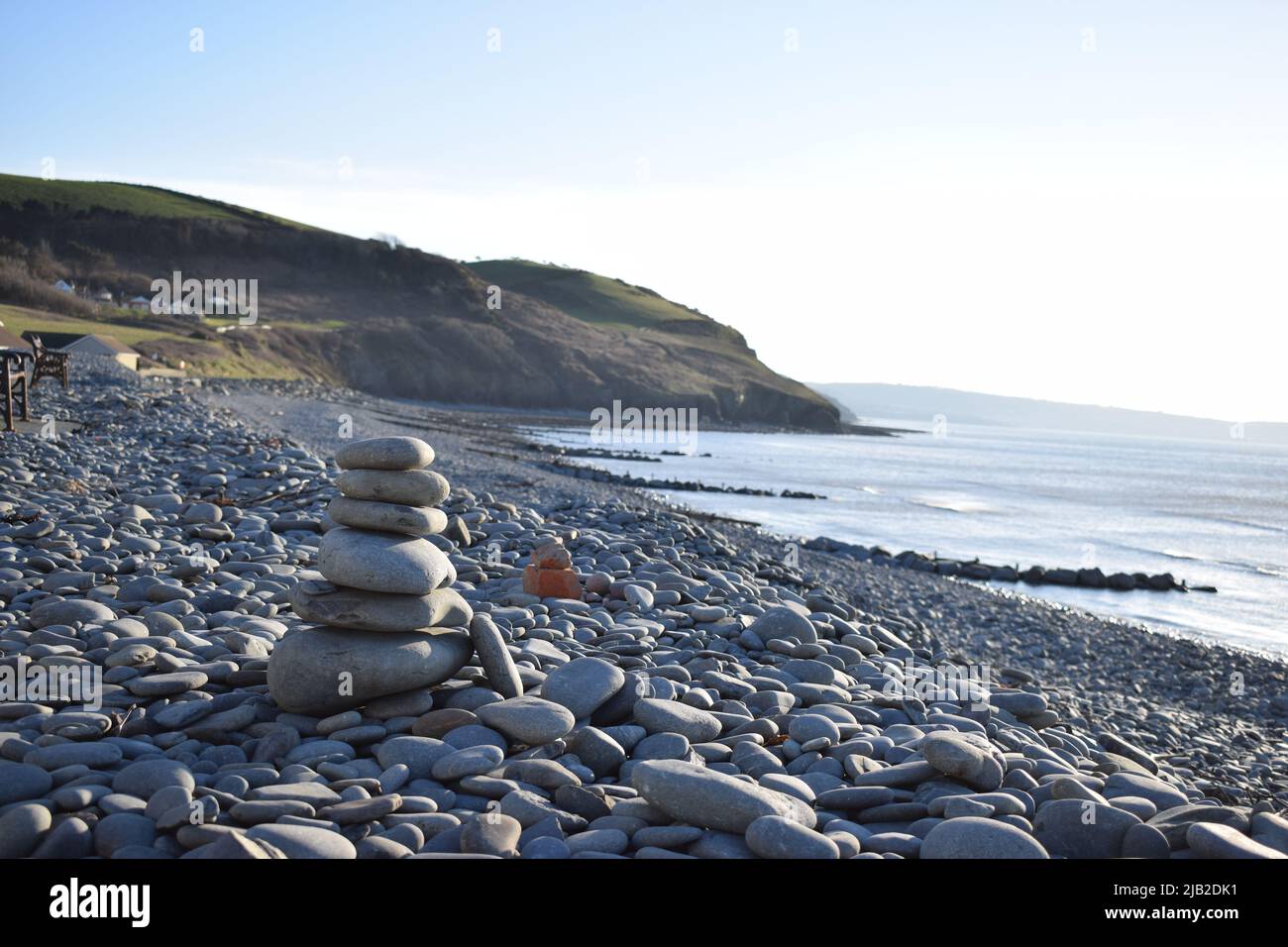 Pebble stack at Aberaeron beach and harbour, Wales, UK Stock Photo - Alamy
