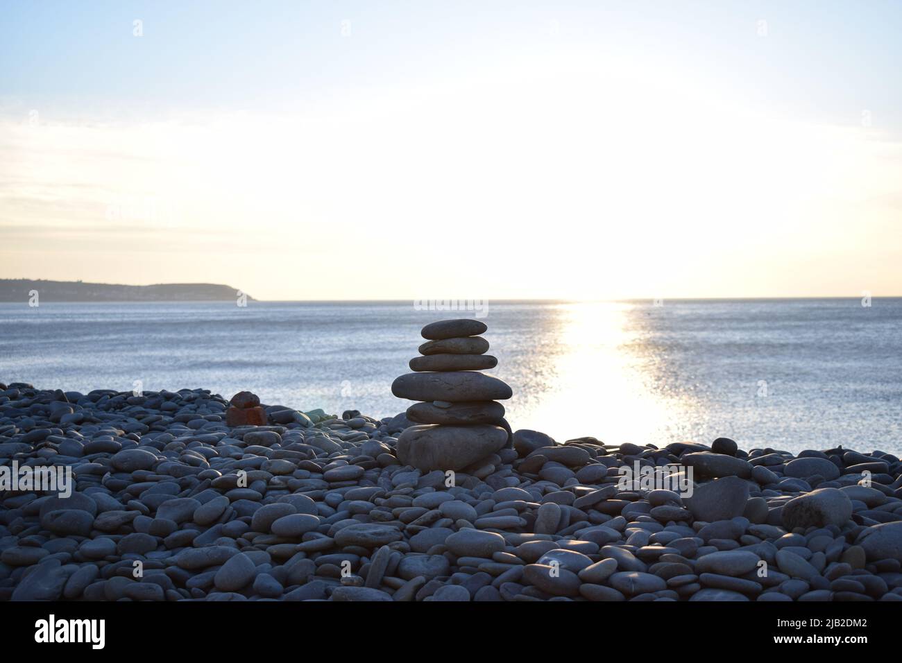 Pebble stack at Aberaeron beach and harbour, Wales, UK Stock Photo - Alamy
