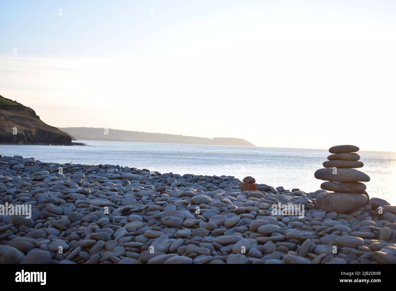 Pebble stack at Aberaeron beach and harbour, Wales, UK Stock Photo - Alamy